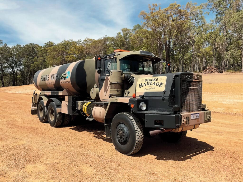1983 military Mack delivers potable water to WA community